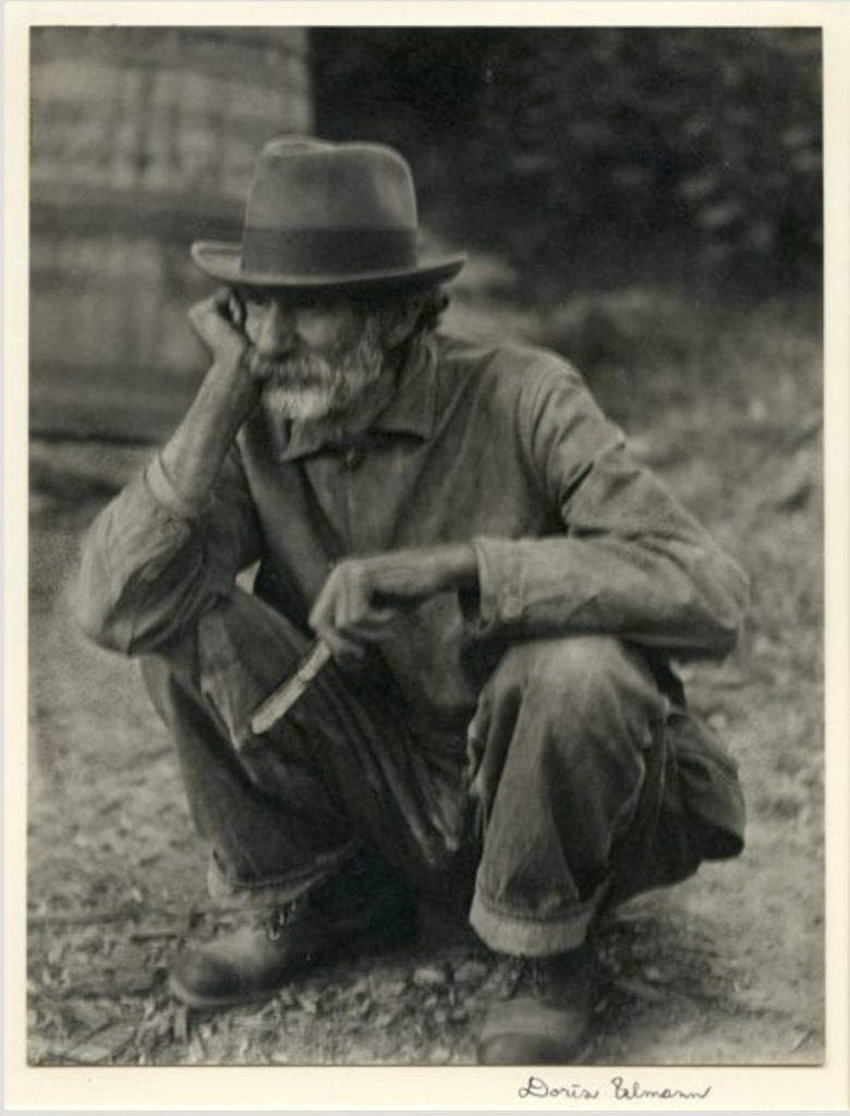 Crouched Man With Stick In Hand - A Gallery for Fine Photography