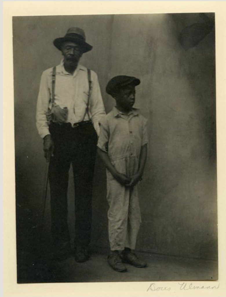 Black Man & Boy With Hats - A Gallery for Fine Photography